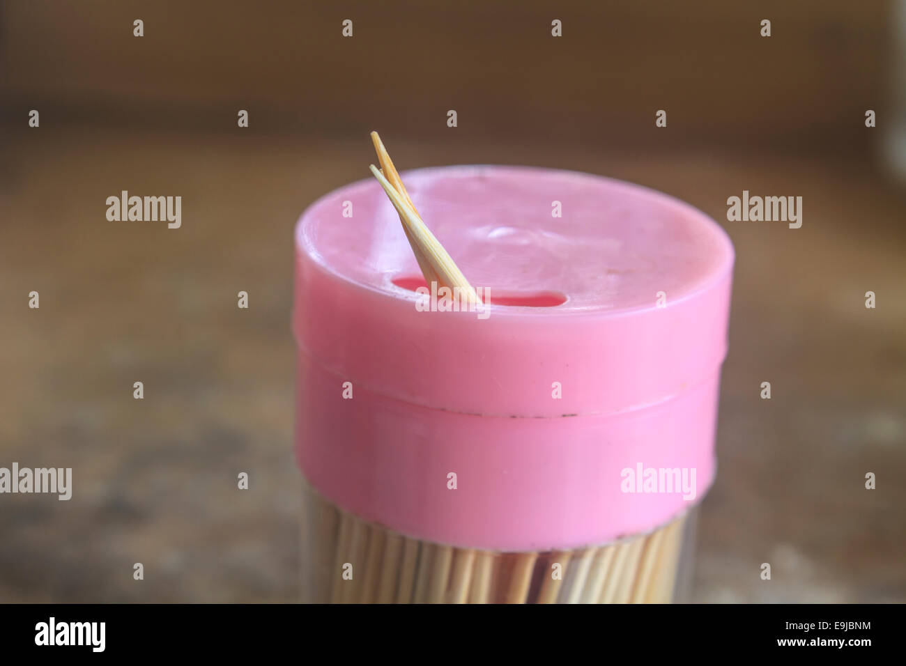 toothpicks in the glass cup with wooden background Stock Photo - Alamy
