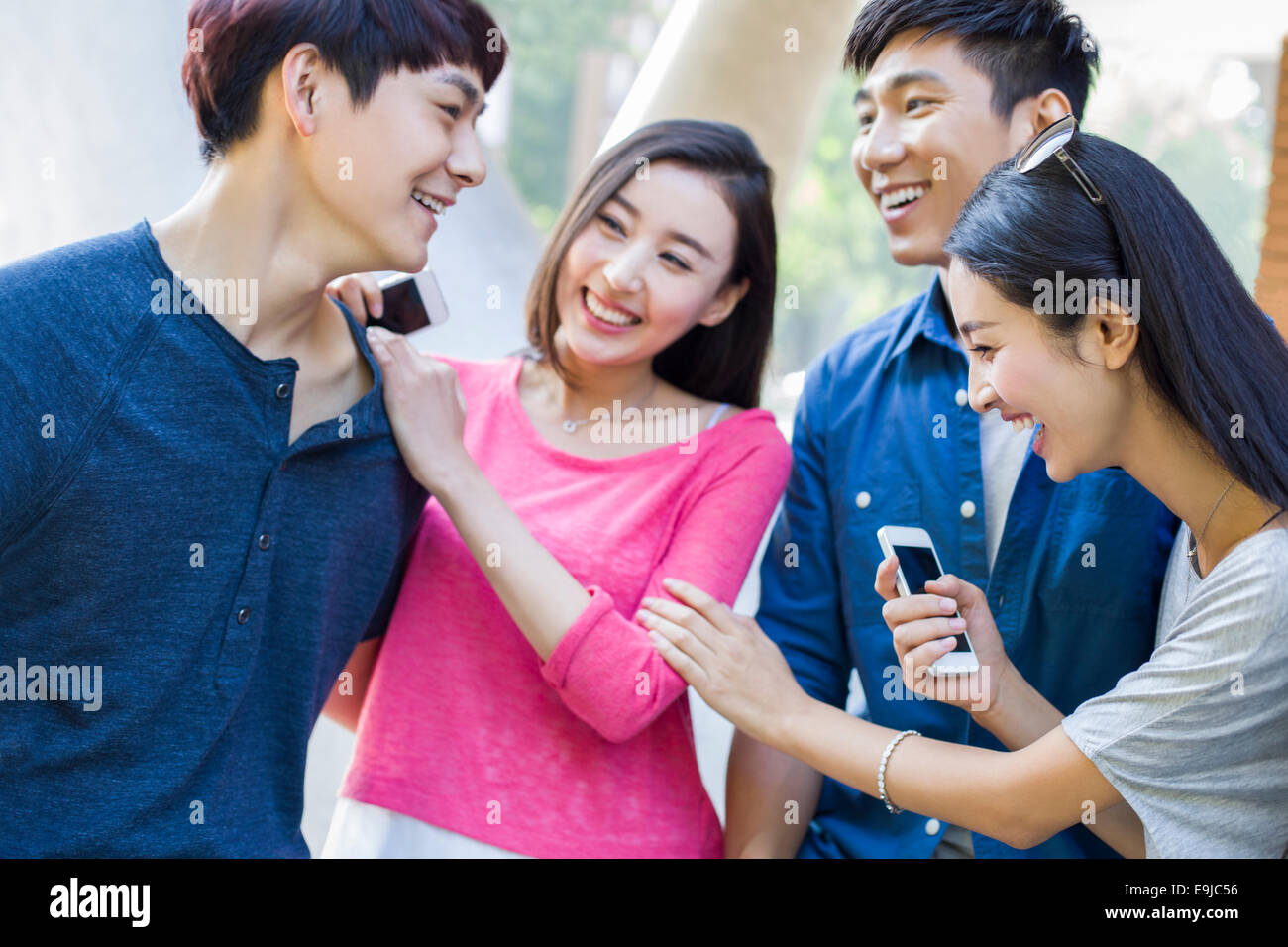 Young friends talking together Stock Photo - Alamy