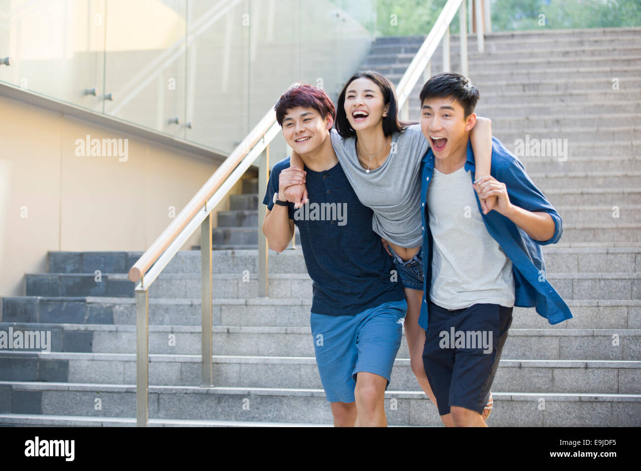 Young friends playing together Stock Photo - Alamy