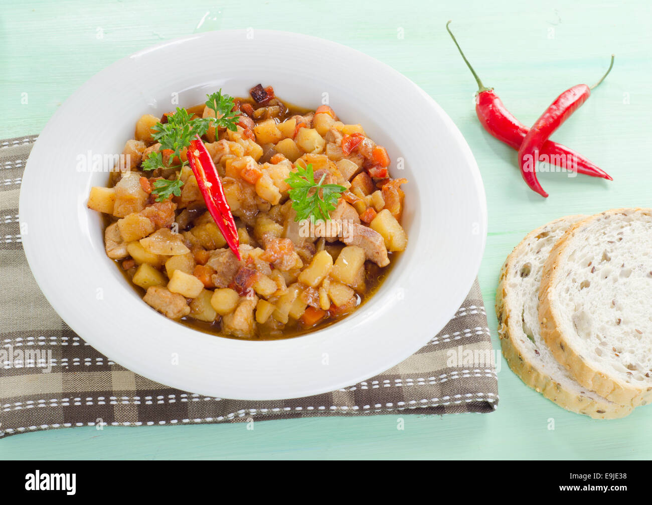 Vegetable and meat stew with chili peppers Stock Photo - Alamy
