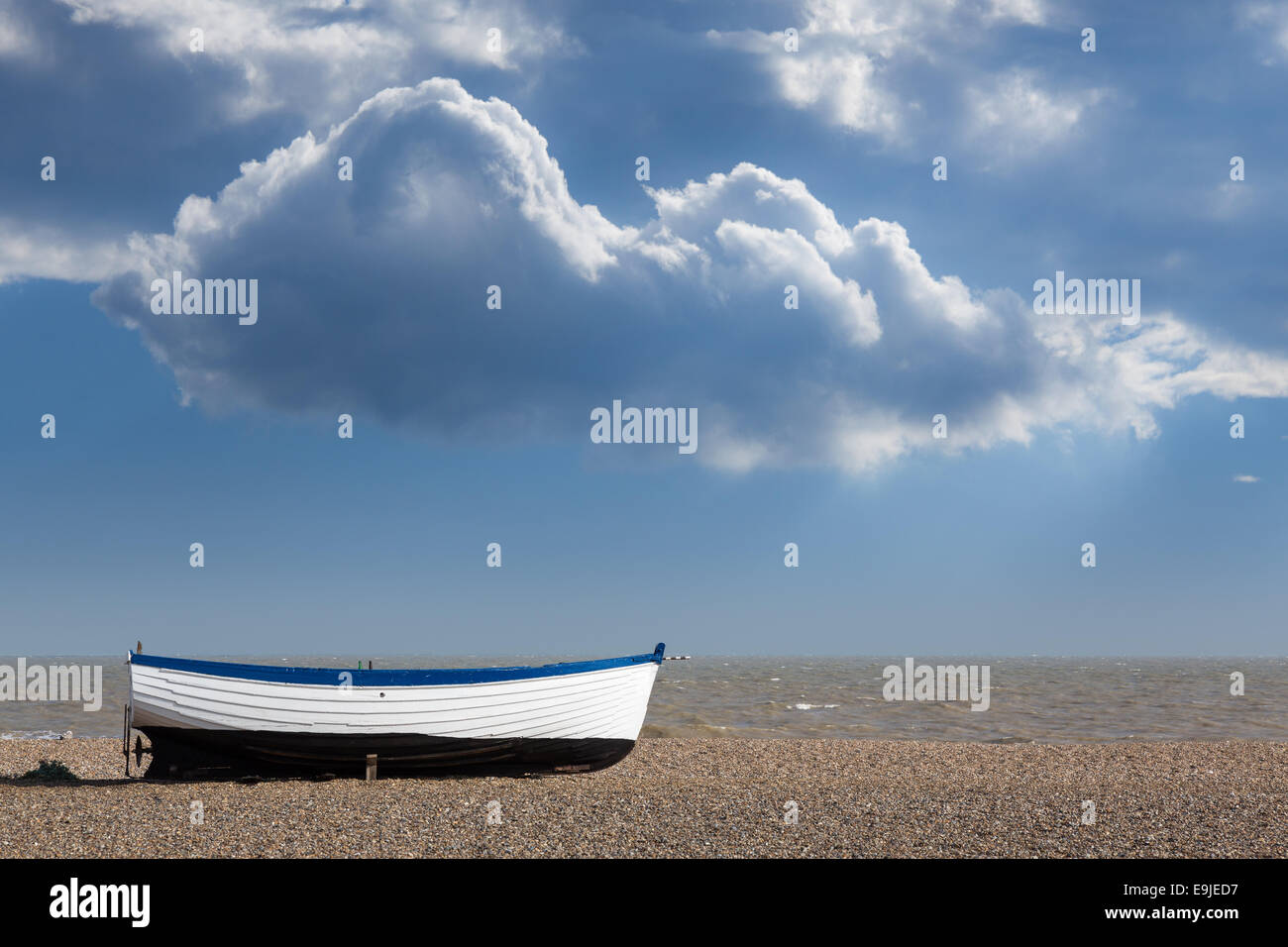 Pebble beach with boat hi-res stock photography and images - Alamy
