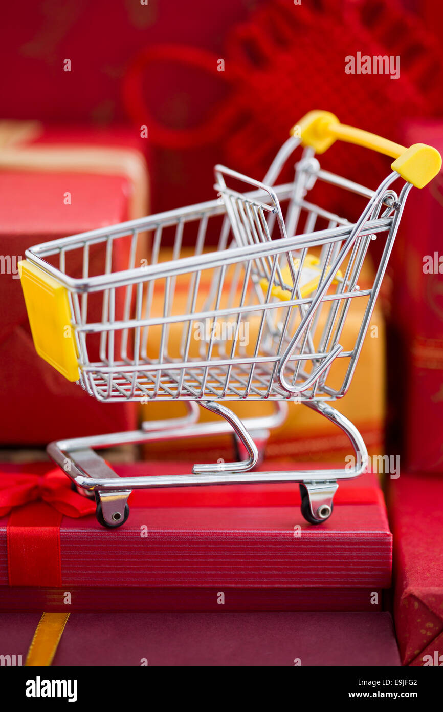 Shopping cart and many red gift boxes Stock Photo - Alamy