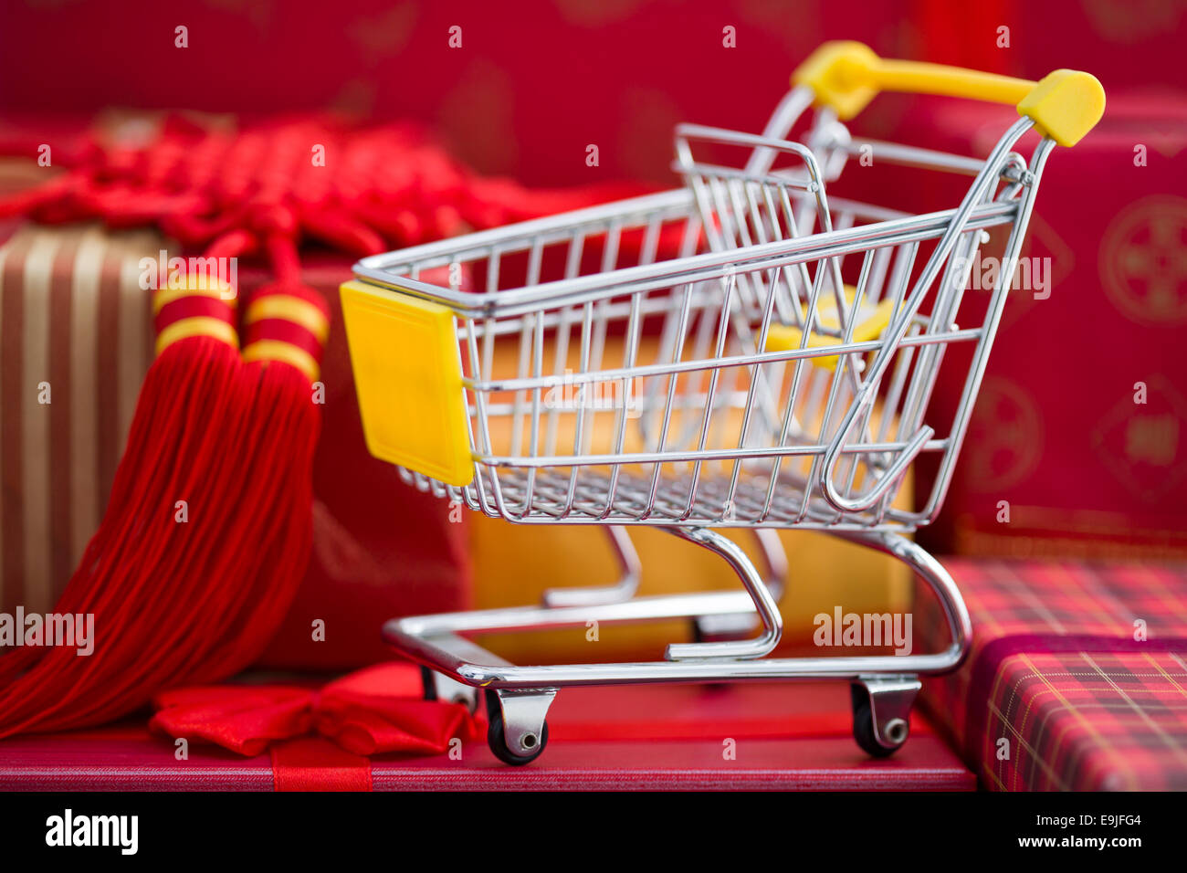 Shopping cart and many red gift boxes Stock Photo - Alamy
