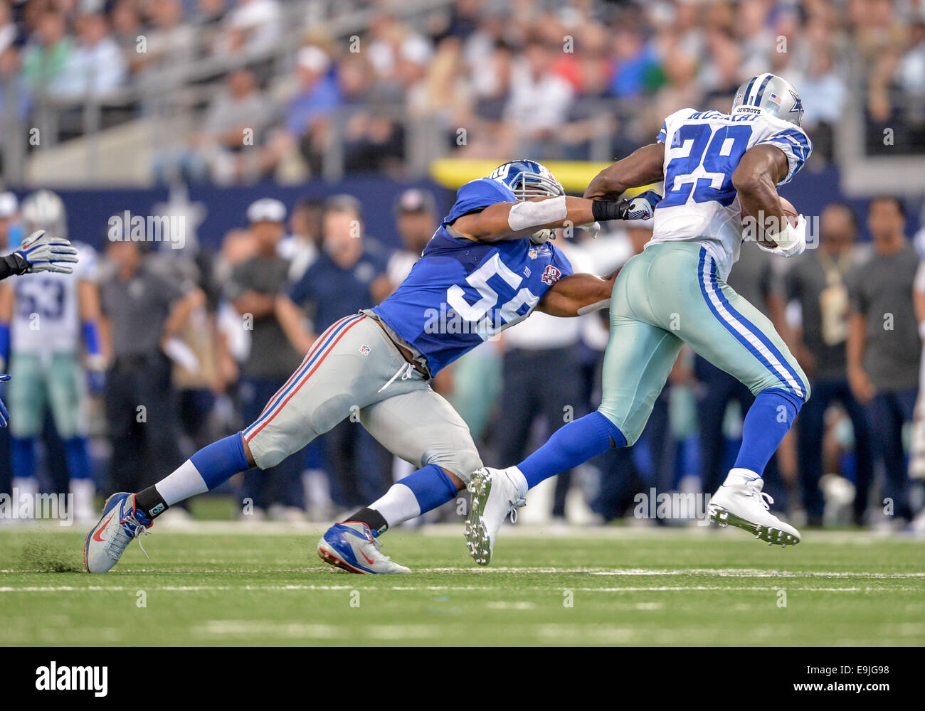 Dallas Cowboys running back DeMarco Murray (29) stiff arms New York ...
