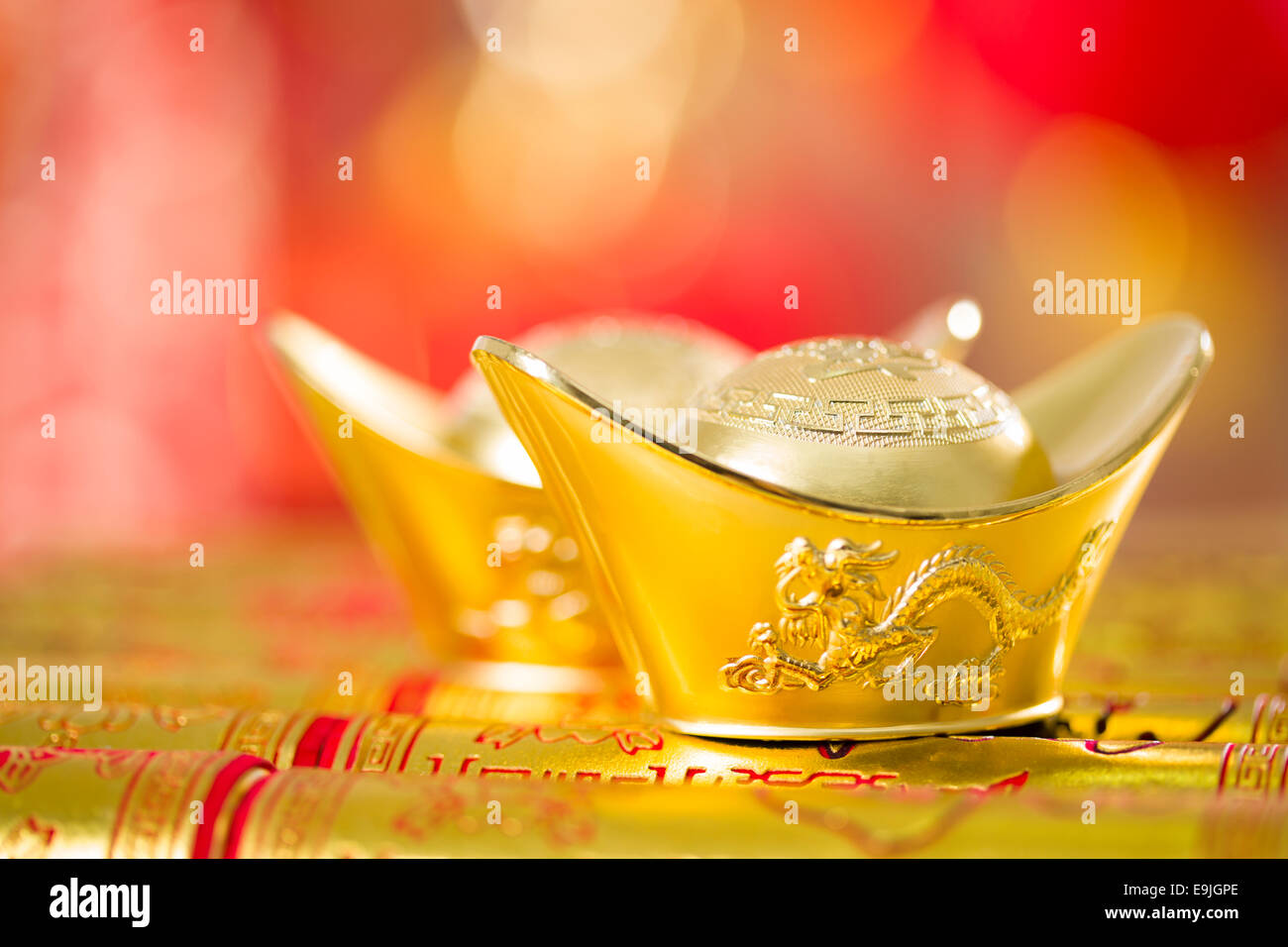 Chinese traditional currency yuanbao and firecrackers Stock Photo - Alamy