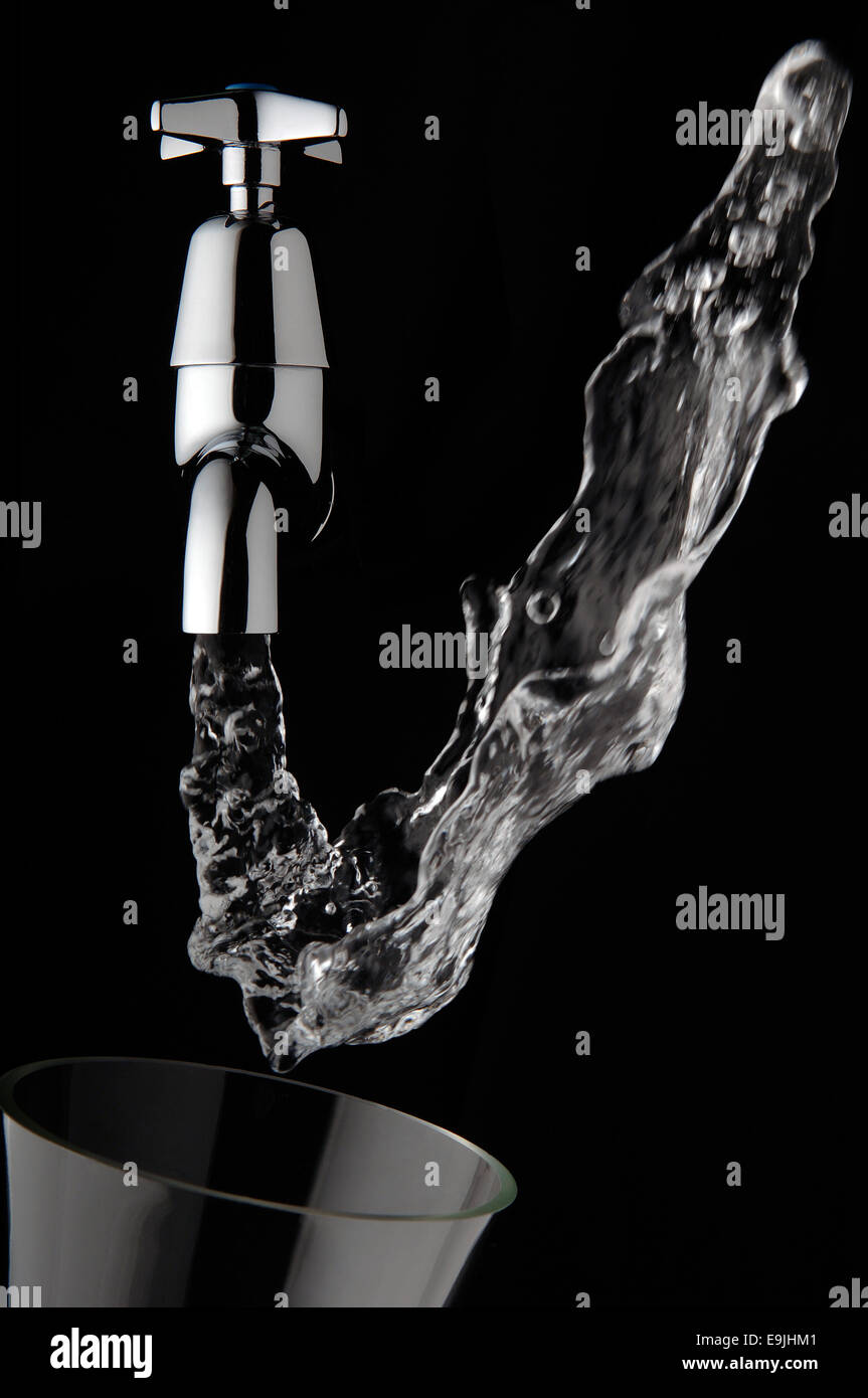 Water flowing upwards out of a tap Stock Photo - Alamy