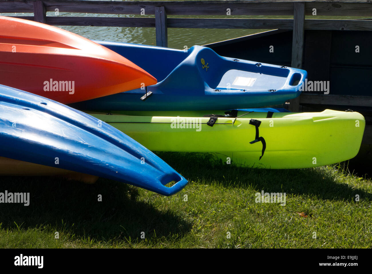 Colorful plastic kayaks Stock Photo - Alamy