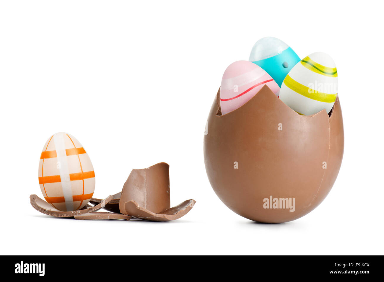 chocolate easter egg broken with scales, on white background Stock ...