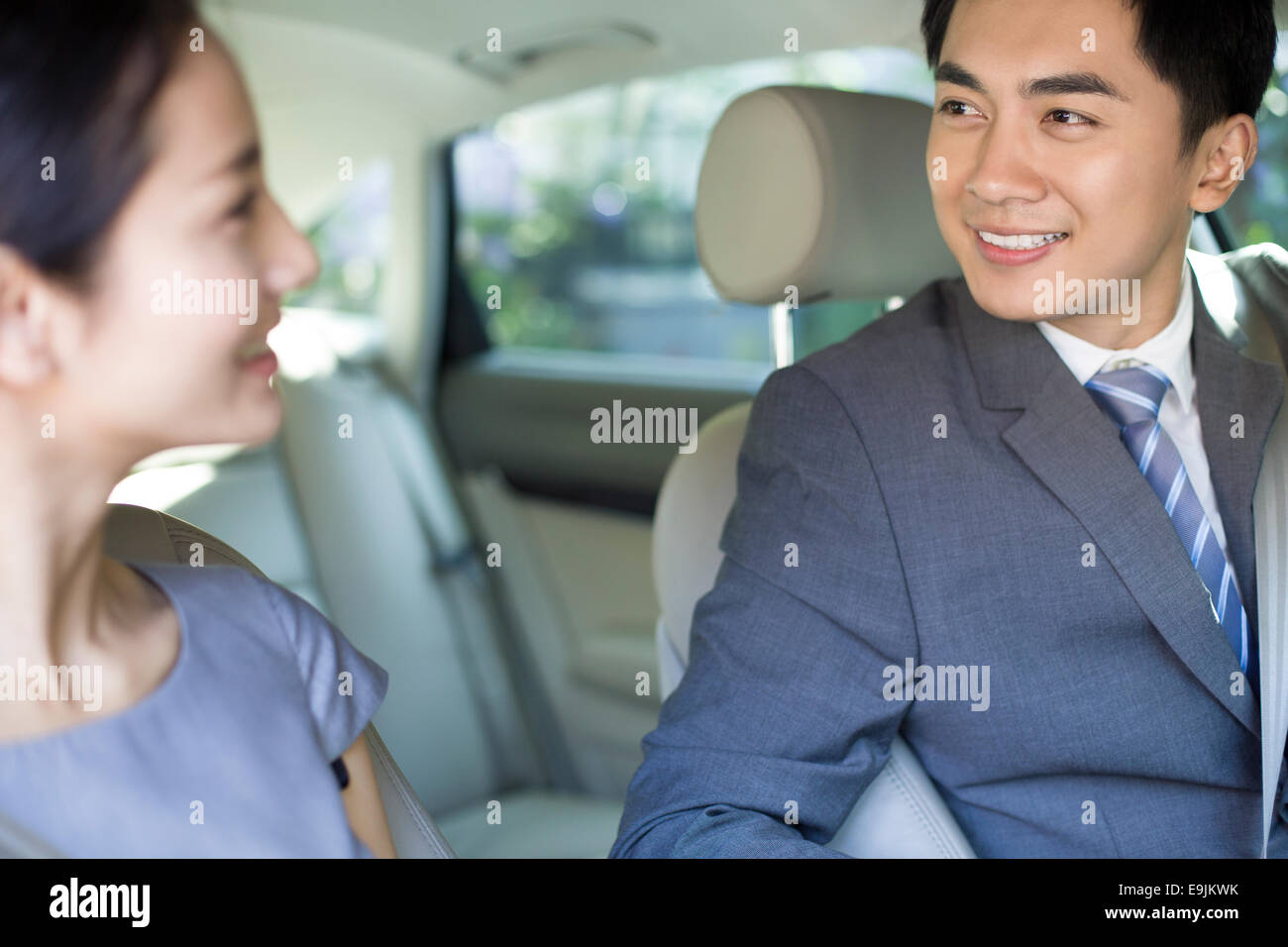 Young couple talking in car Stock Photo - Alamy