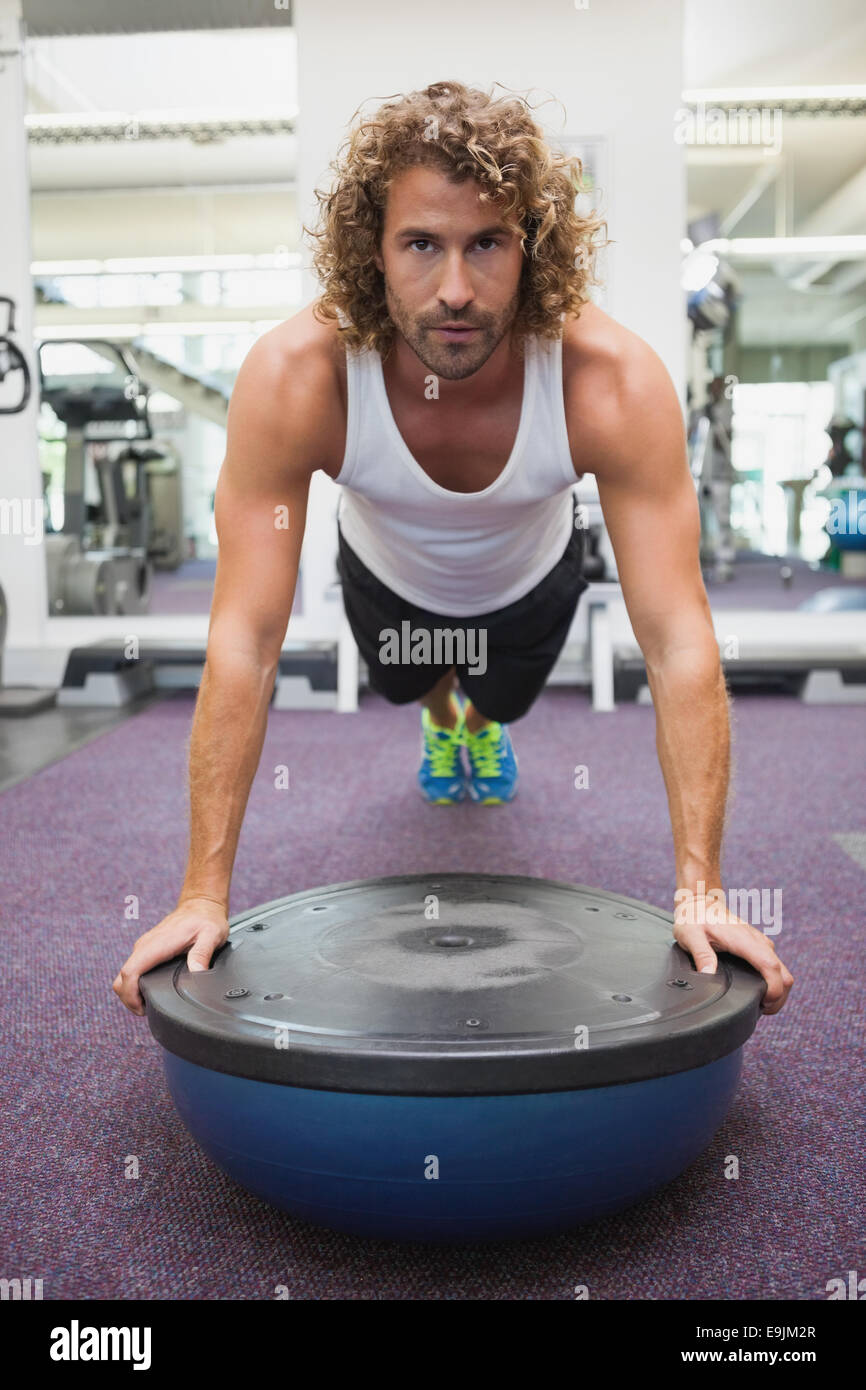 Handsome man doing crossfit fitness workout in gym Stock Photo - Alamy