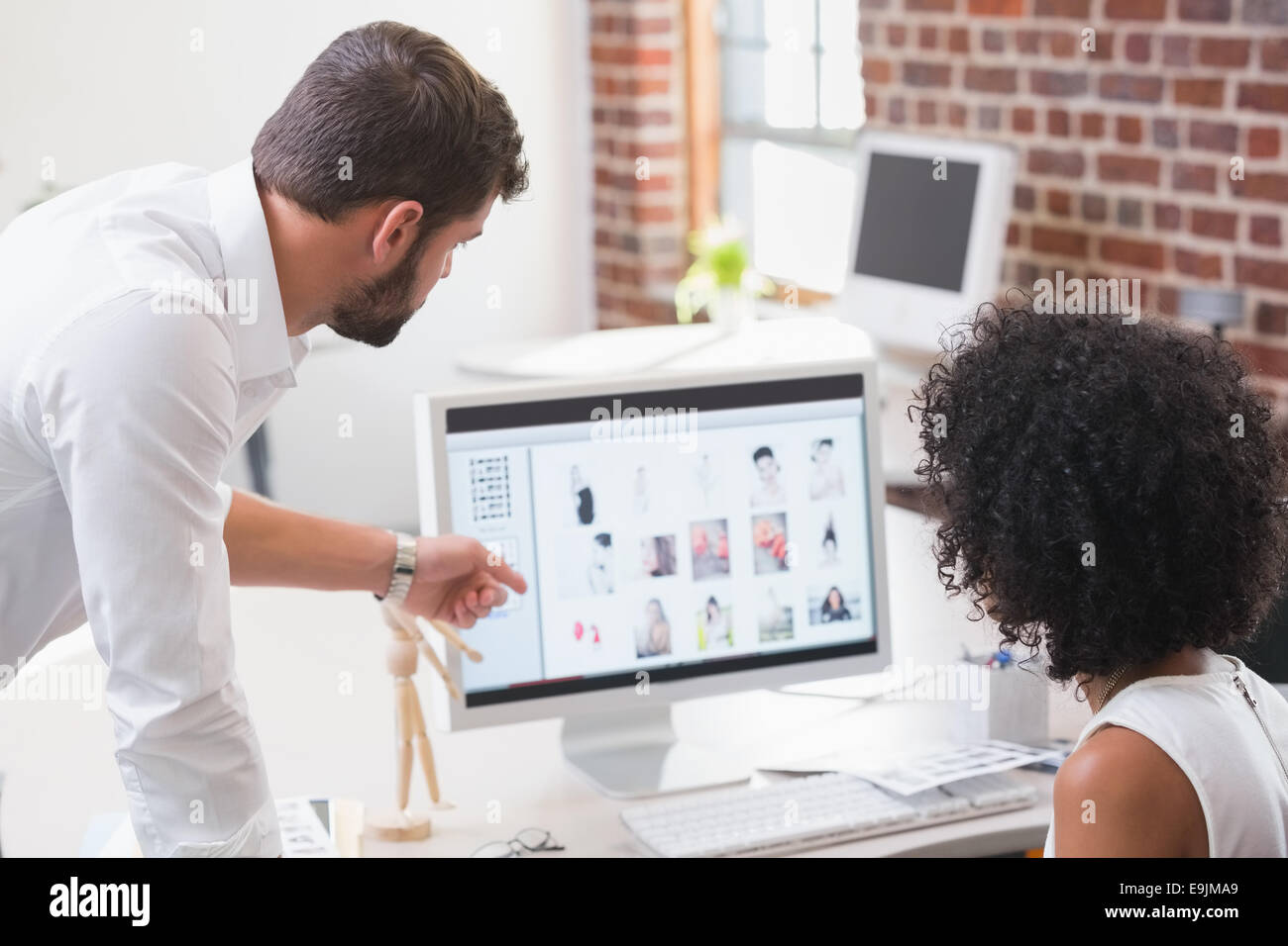 Two photo editors at work Stock Photo - Alamy