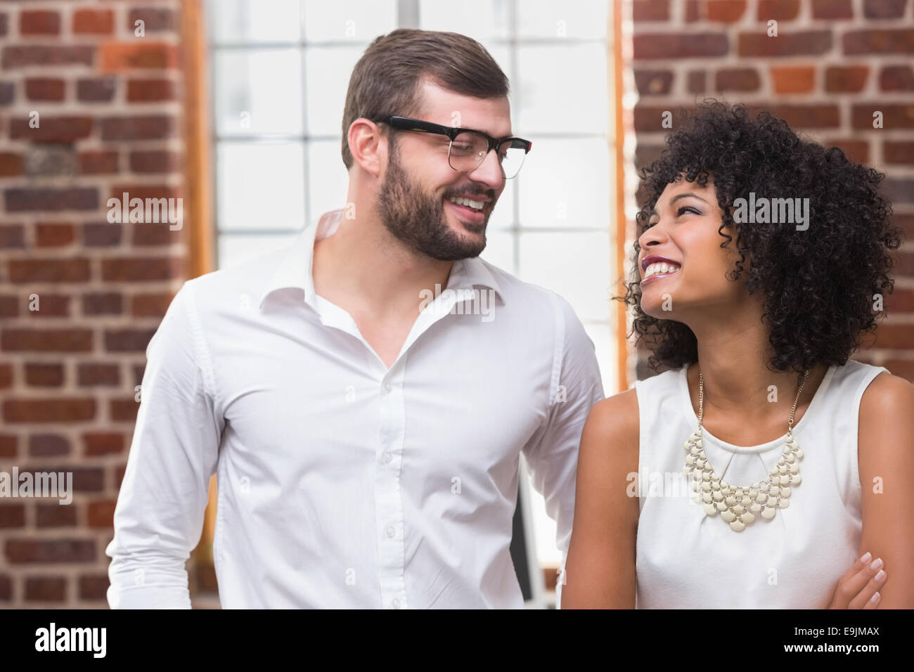 Cheerful young business people in office Stock Photo - Alamy