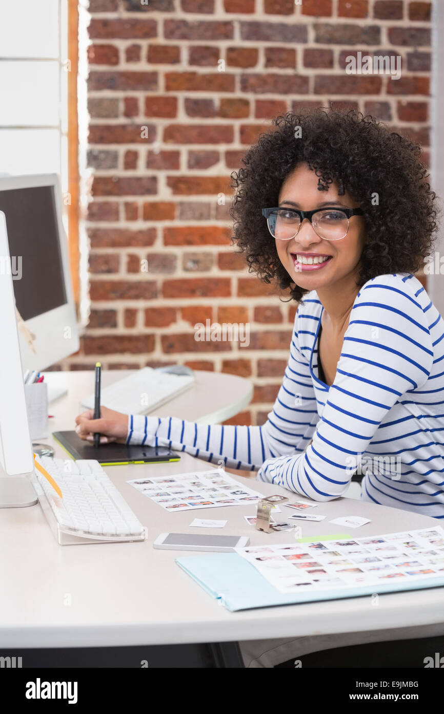 Female photo editor using digitizer in office Stock Photo - Alamy