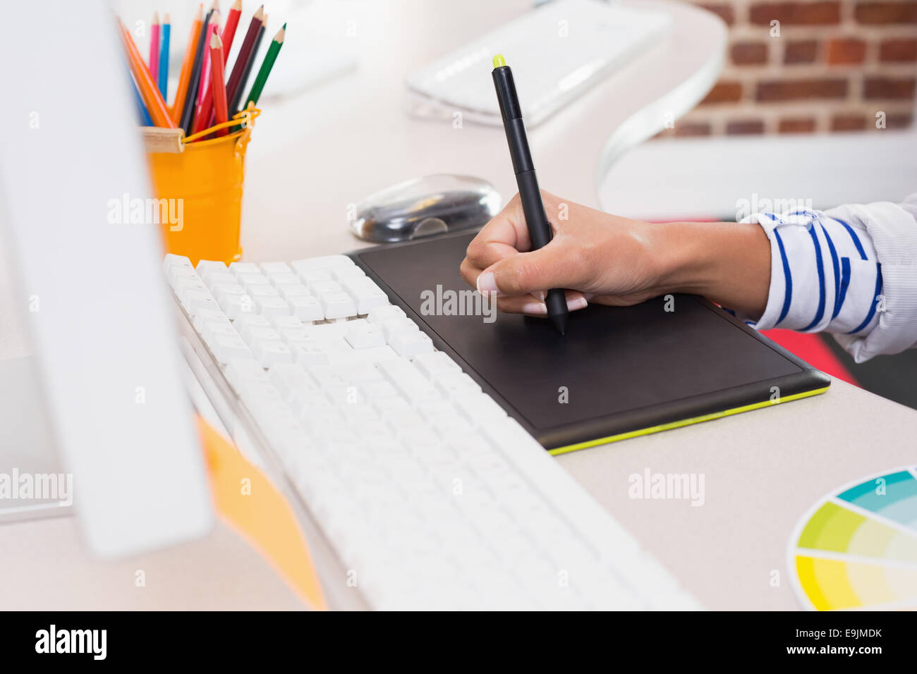 Hand using digitizer in office Stock Photo - Alamy