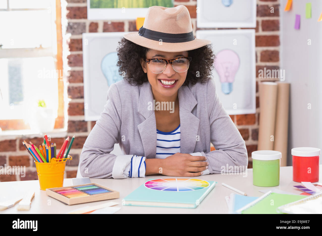 Portrait of female interior designer at desk Stock Photo - Alamy