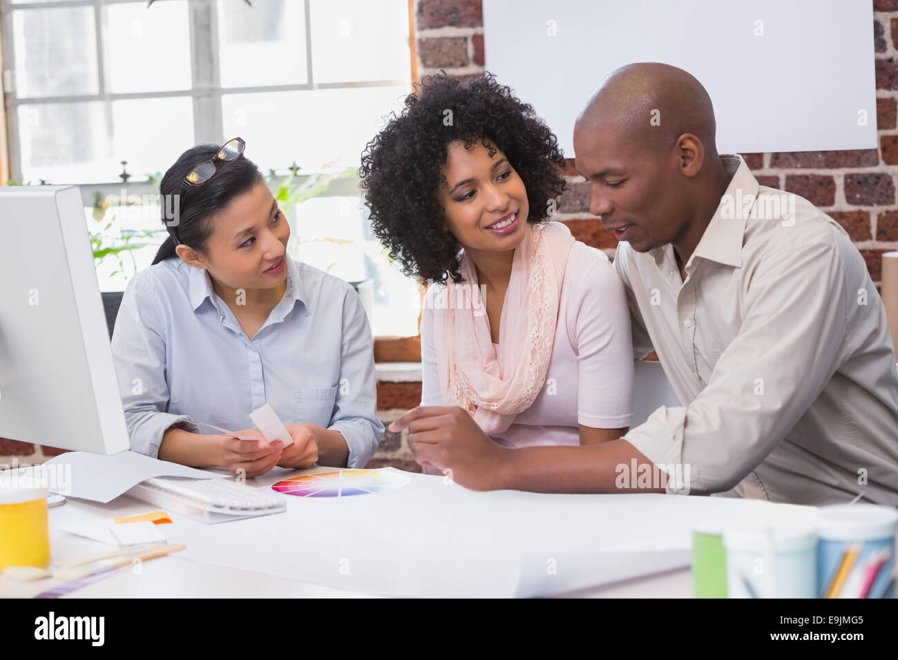 Interior designer speaking with clients Stock Photo - Alamy