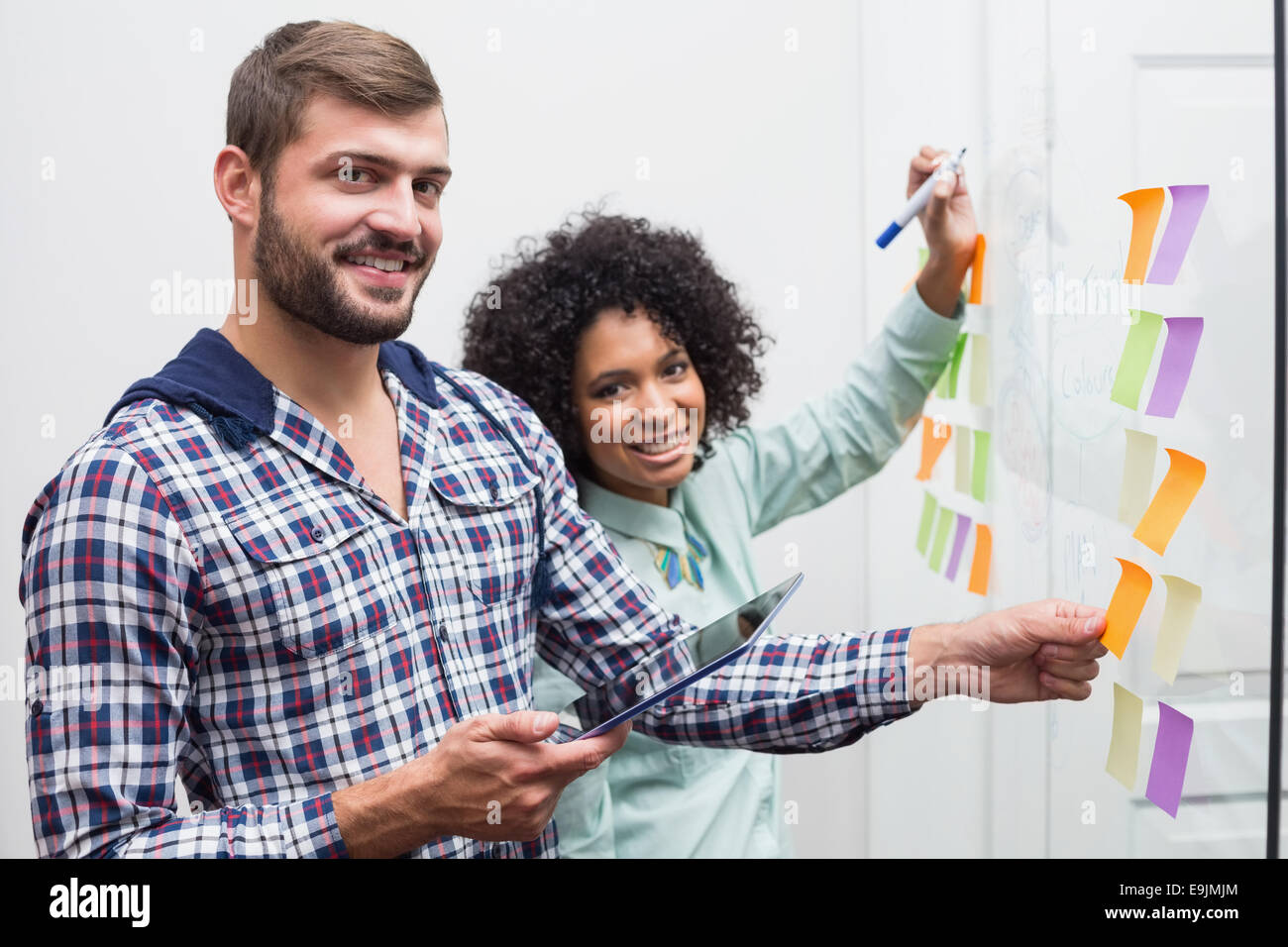 Team with sticky notes on window Stock Photo - Alamy