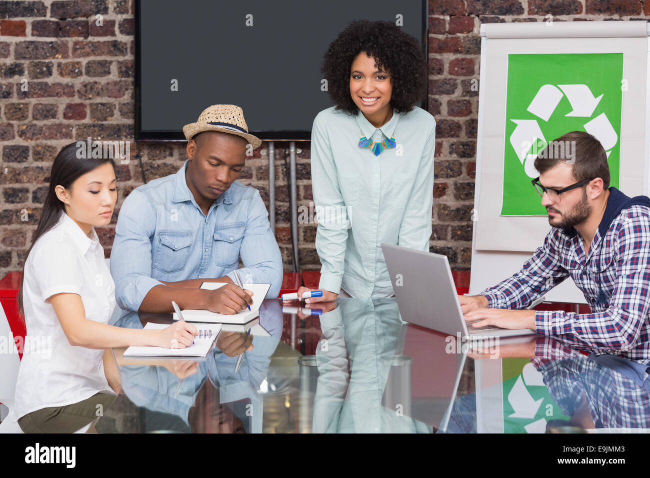 Team in meeting with recycling symbol on whiteboard Stock Photo - Alamy