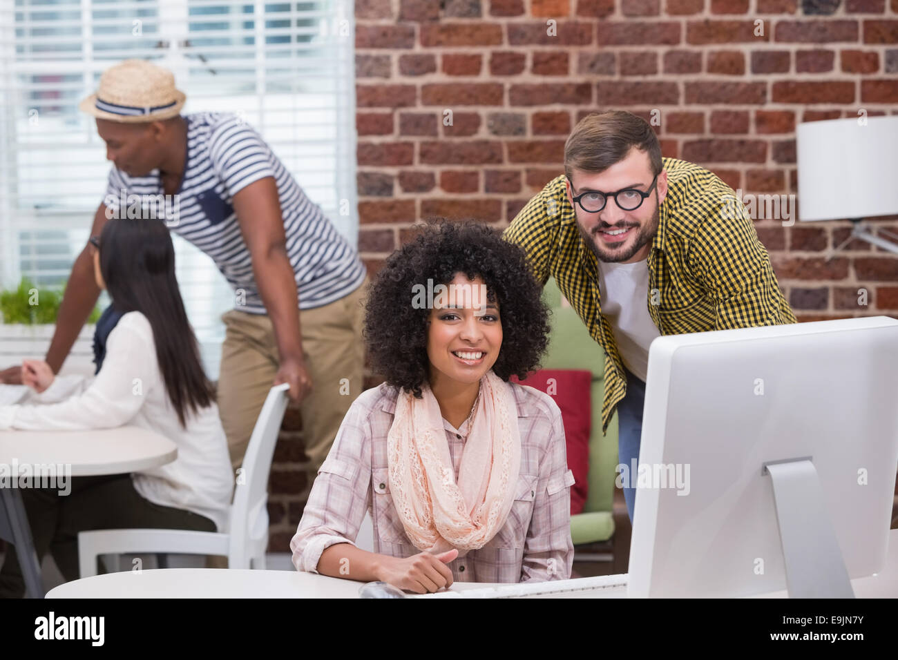 Creative business people using computer Stock Photo - Alamy