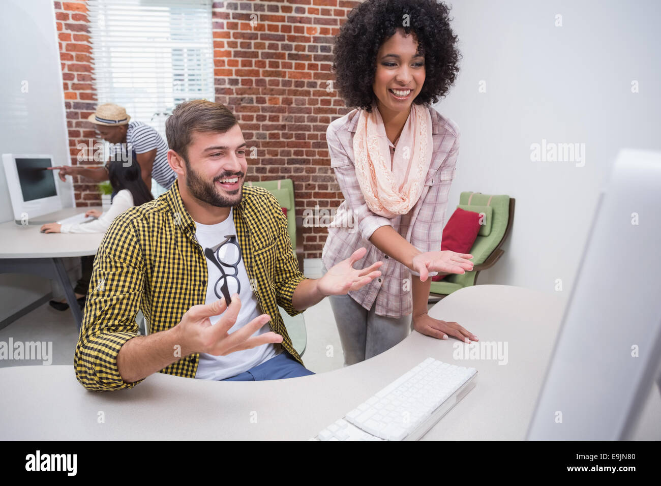Creative business people using computer Stock Photo - Alamy