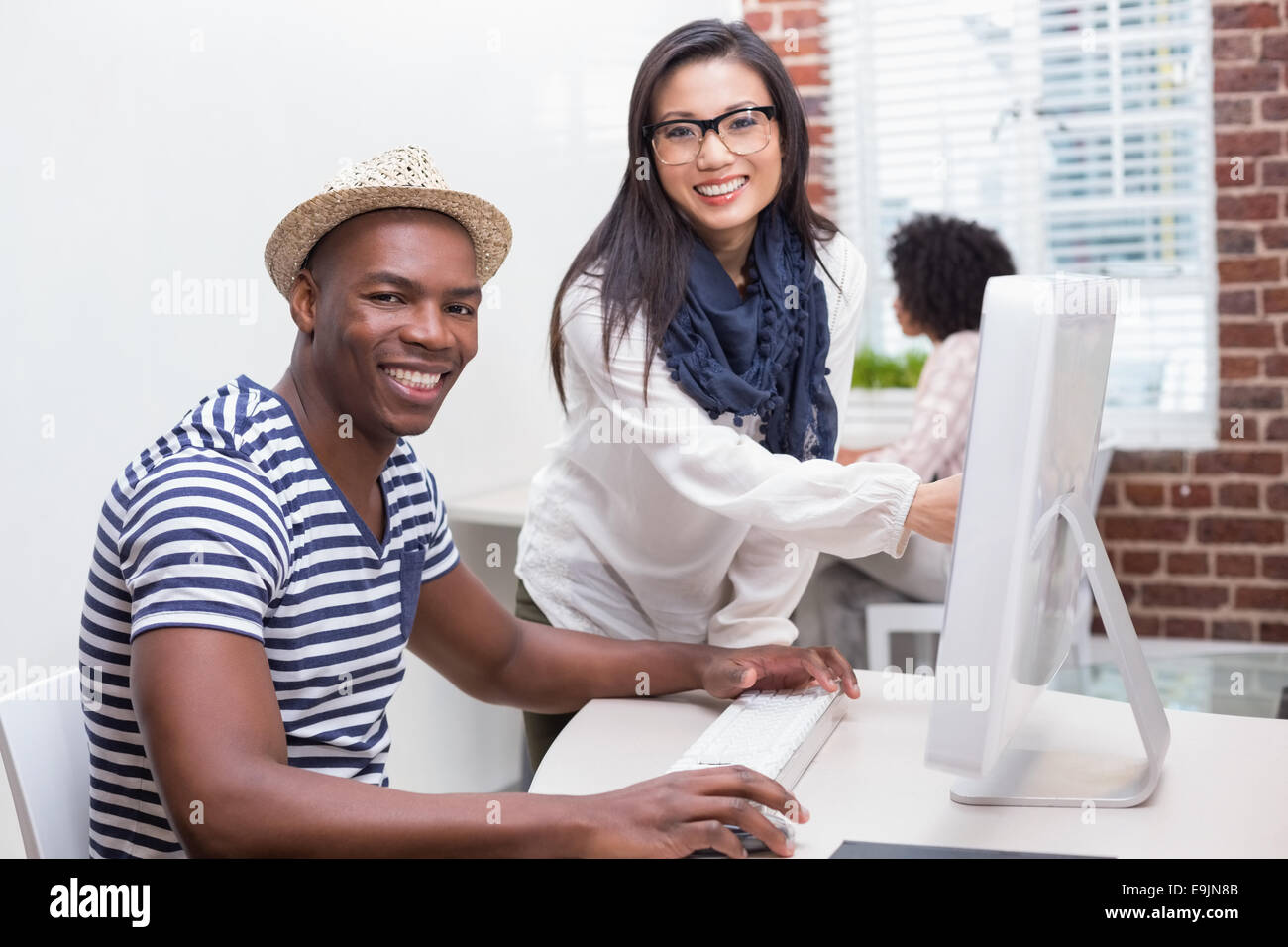 Creative business people using computer Stock Photo - Alamy