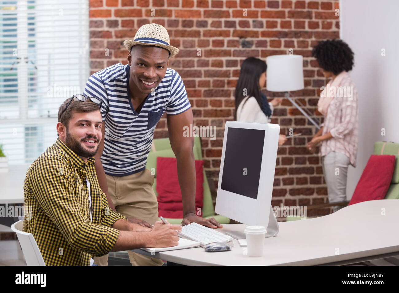 Portrait of two casual business people Stock Photo - Alamy