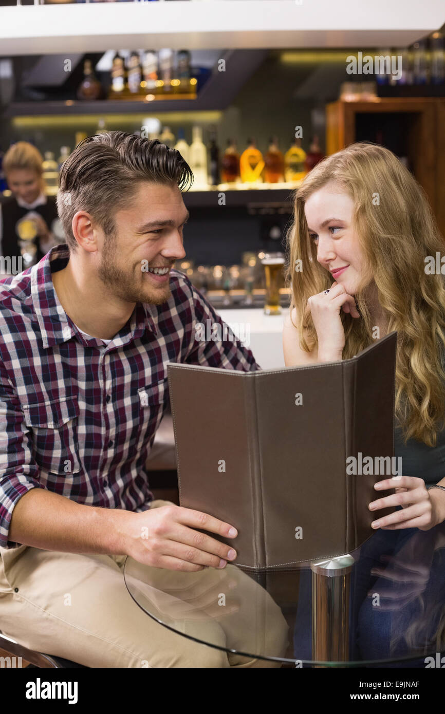 Young couple discussing the menu Stock Photo - Alamy