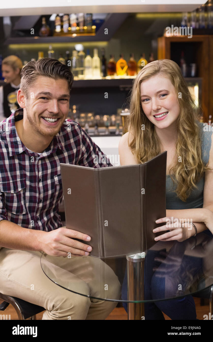 Young couple discussing the menu Stock Photo - Alamy