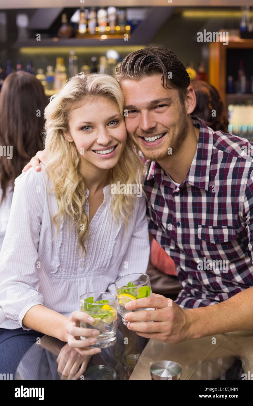 Young couple having a drink together Stock Photo - Alamy