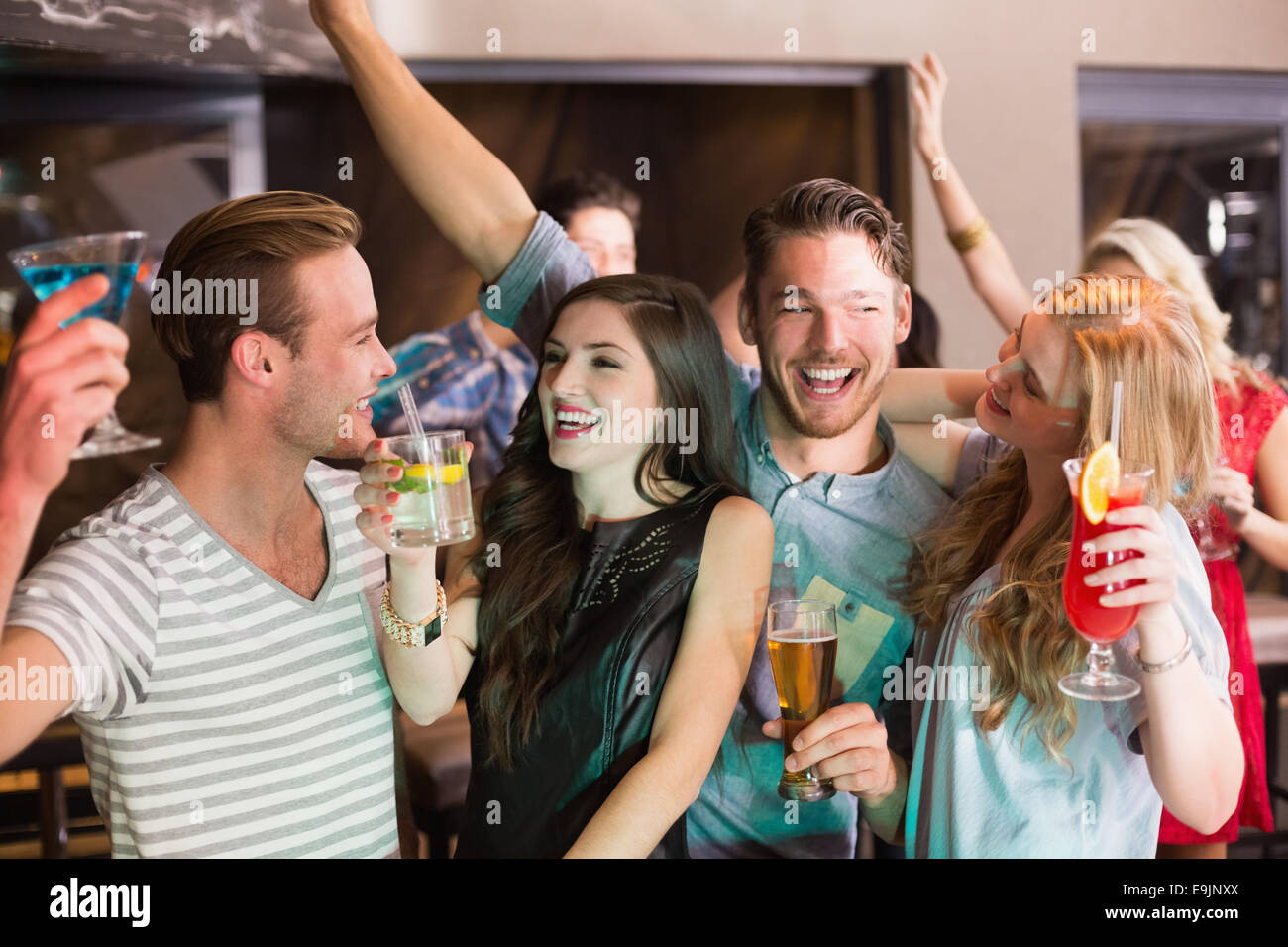 Young man celebrating friends drinking hi-res stock photography and ...