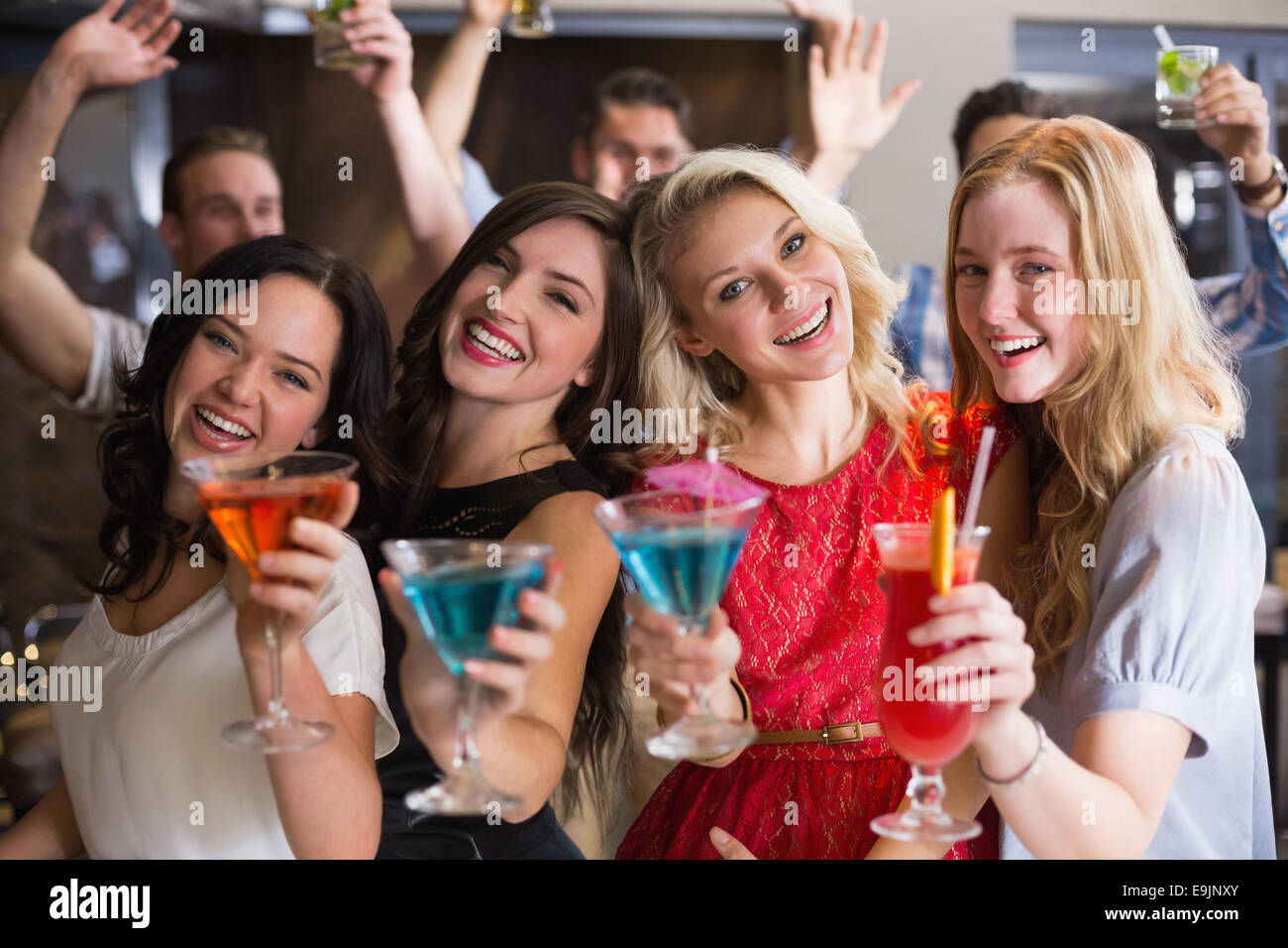 Young friends having a drink together Stock Photo - Alamy