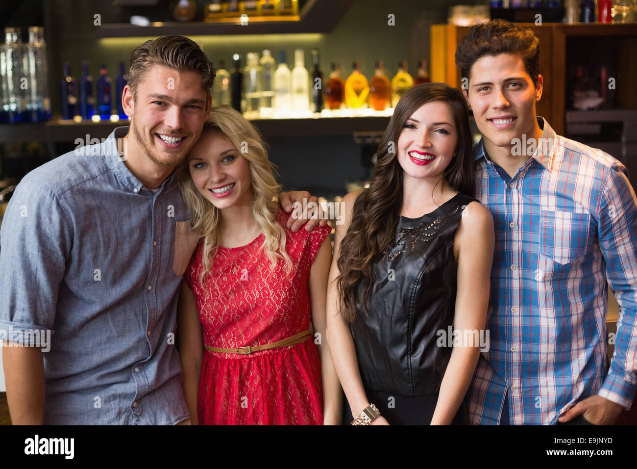 Happy friends smiling at camera Stock Photo - Alamy
