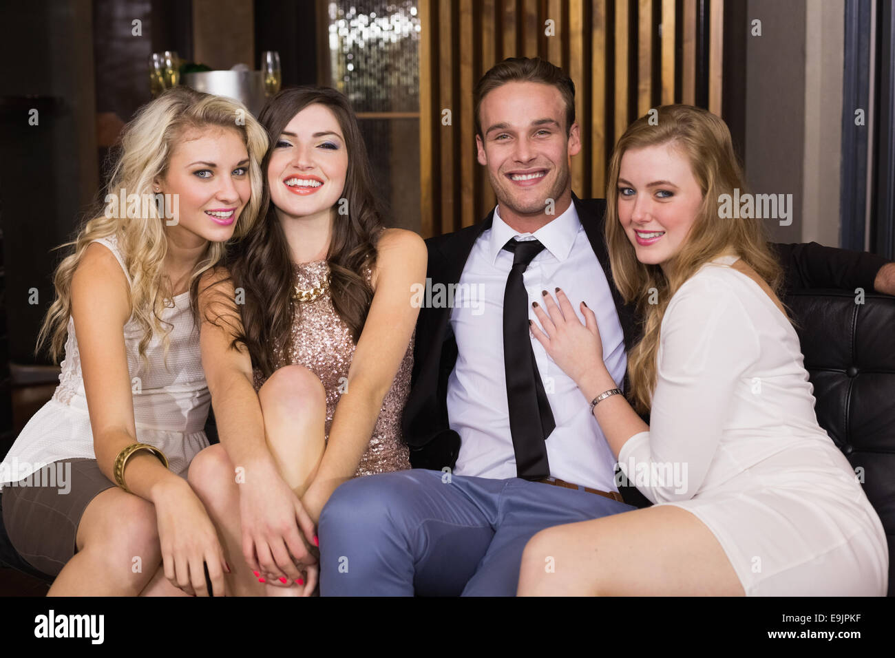 Happy friends smiling at camera Stock Photo - Alamy