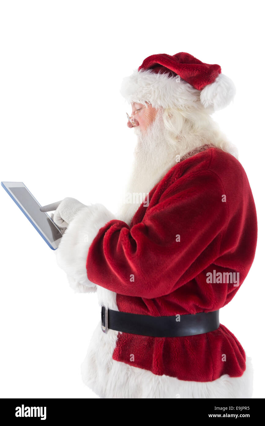 Santa uses a tablet PC Stock Photo - Alamy