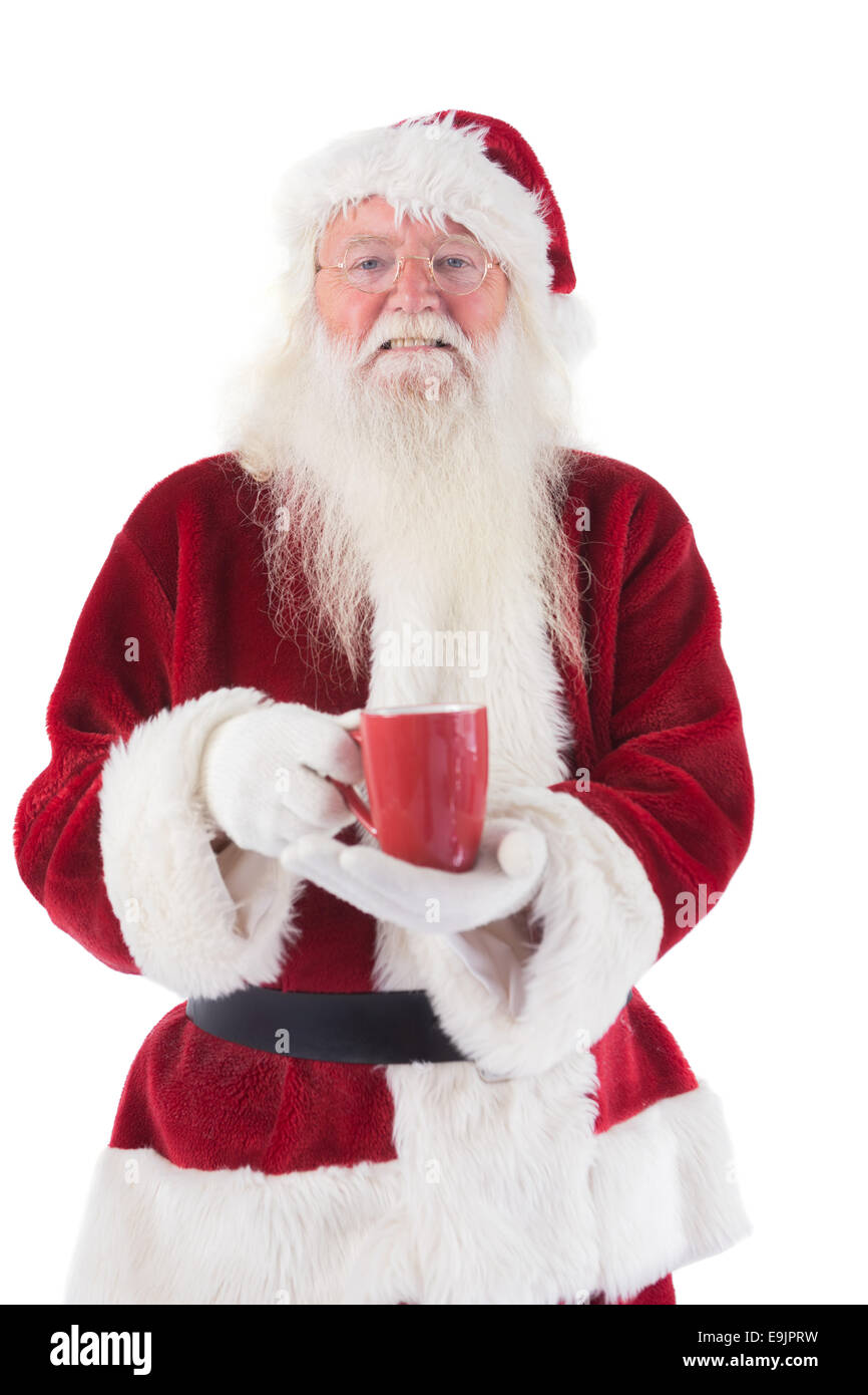 Santa holds a red cup Stock Photo - Alamy