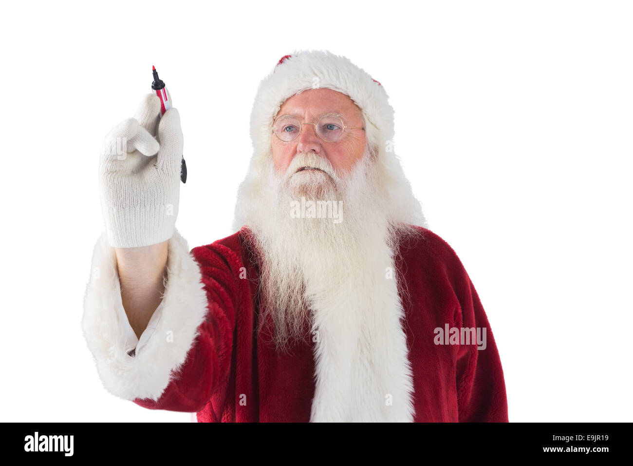 Santa writes something with a pen Stock Photo - Alamy