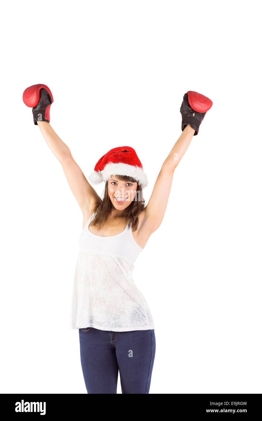 Festive brunette cheering with boxing gloves Stock Photo - Alamy
