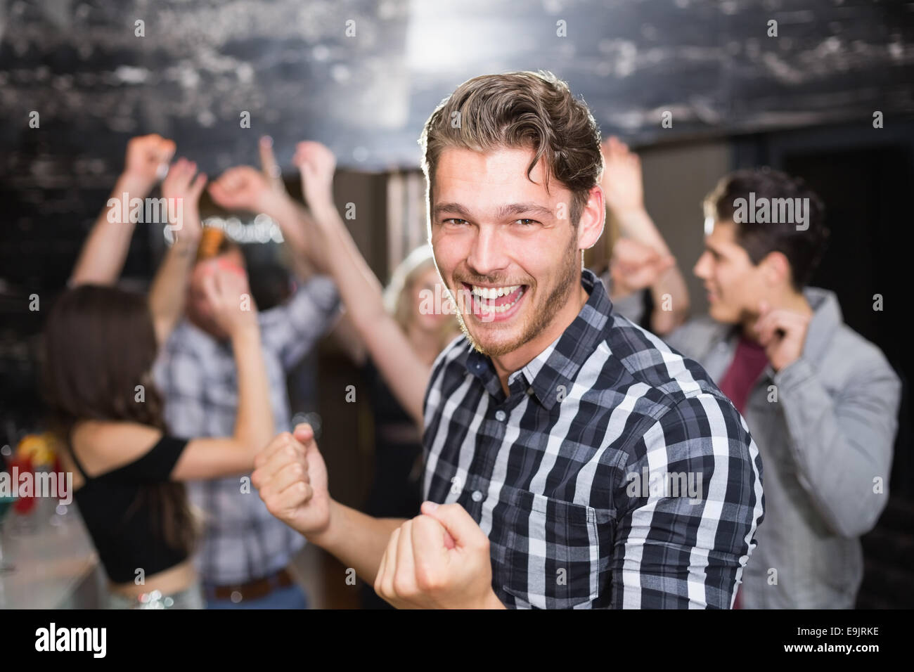 Stylish man smiling and dancing Stock Photo - Alamy