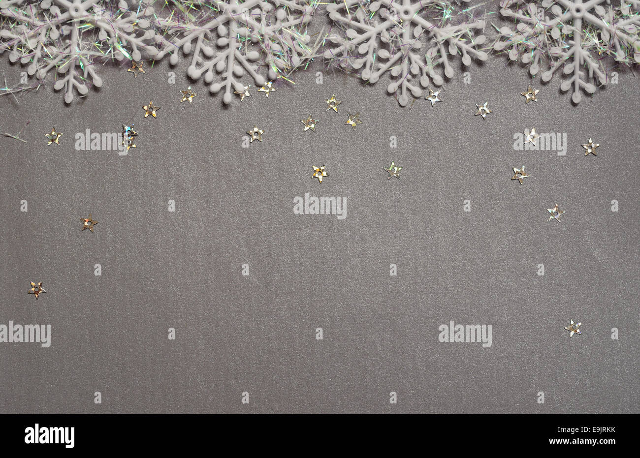 Snowflakes edge on silver paper background Stock Photo - Alamy