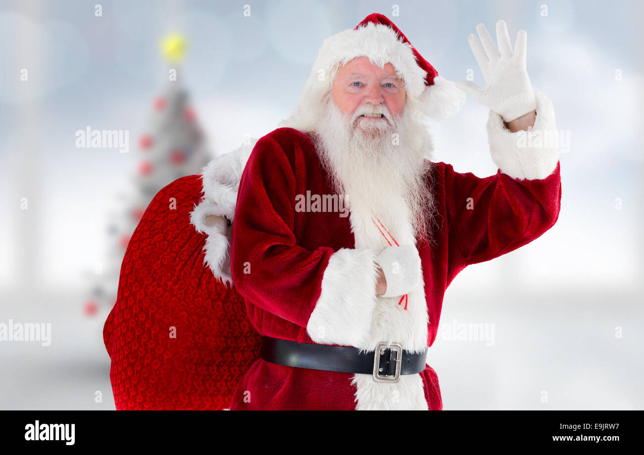 Composite image of santa claus waving Stock Photo - Alamy