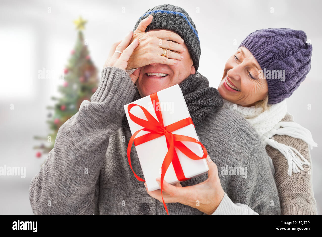Composite image of mature woman surprising partner with gift Stock ...