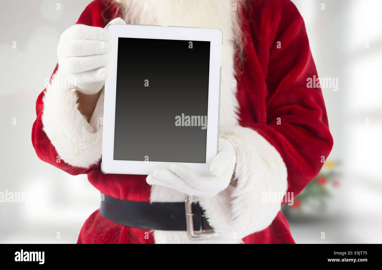 Composite image of santa claus showing tablet pc Stock Photo - Alamy