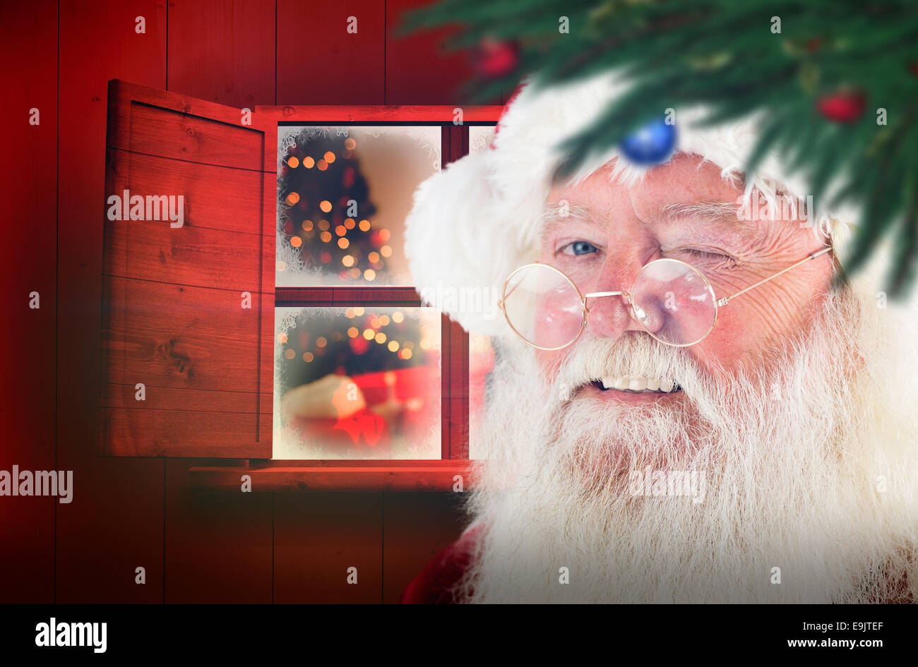 Composite image of santa claus winking Stock Photo - Alamy
