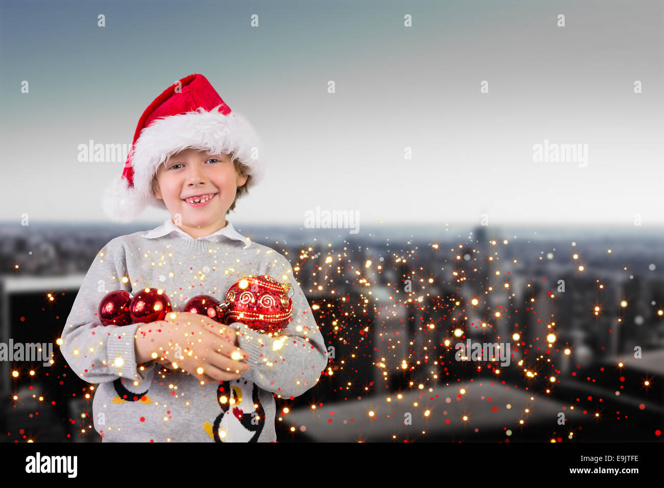 Composite image of festive boy smiling Stock Photo - Alamy
