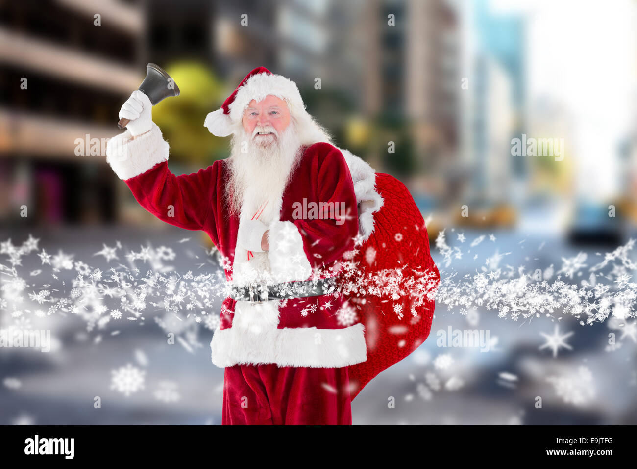 Composite image of santa claus ringing bell Stock Photo - Alamy