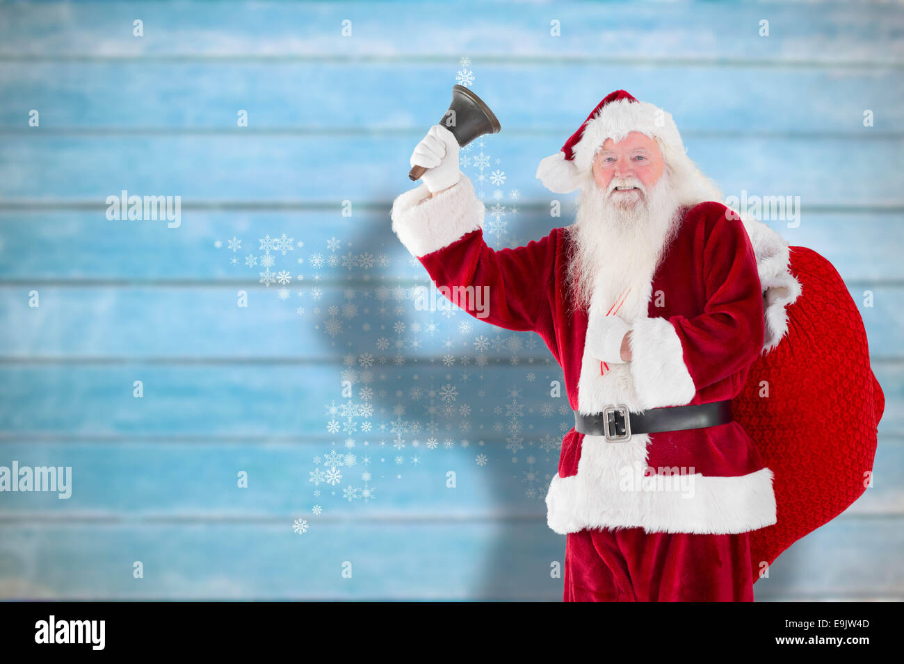 Composite image of santa claus ringing bell Stock Photo - Alamy