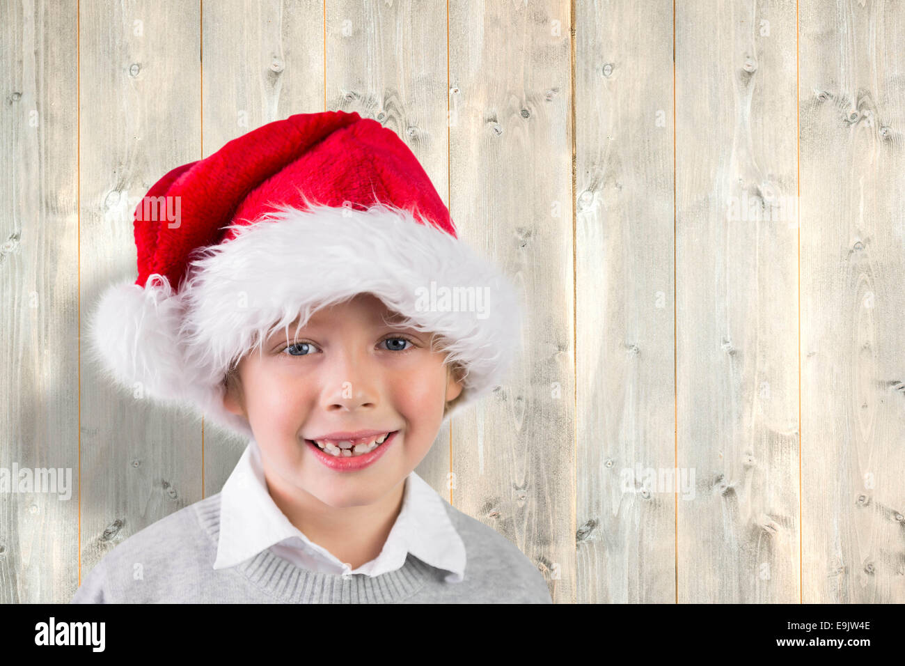 Composite image of festive boy smiling Stock Photo - Alamy
