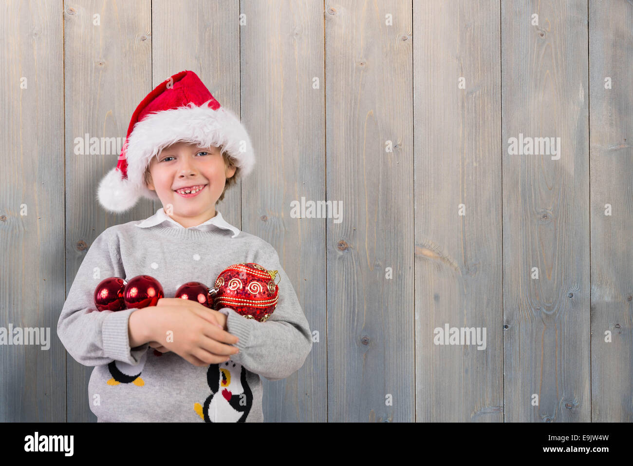 Composite image of festive boy smiling Stock Photo - Alamy