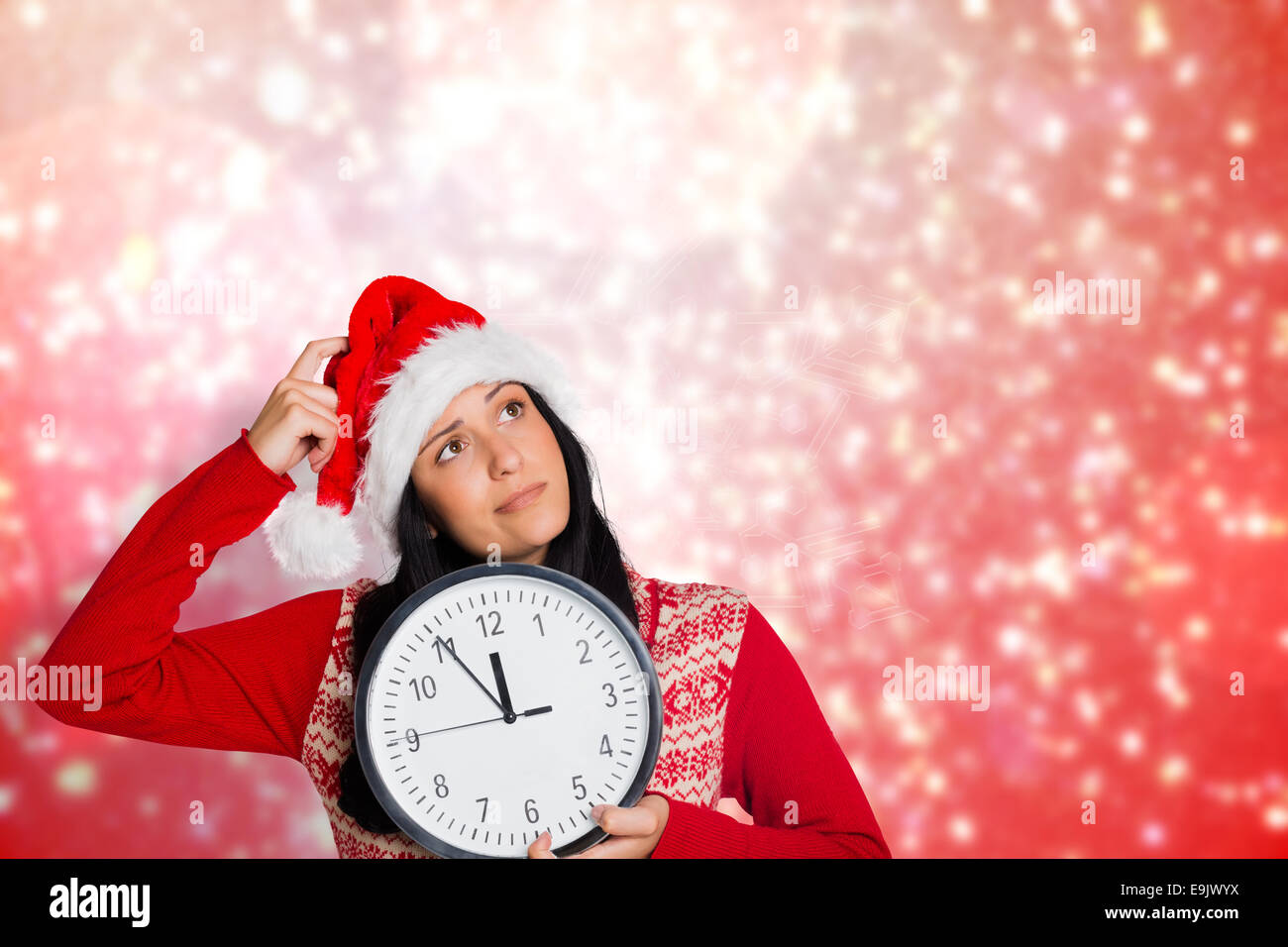 Composite image of woman thinking about the time Stock Photo - Alamy