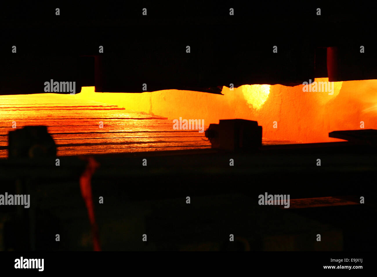 Hot gas and flame in steel reheating furnace Stock Photo - Alamy